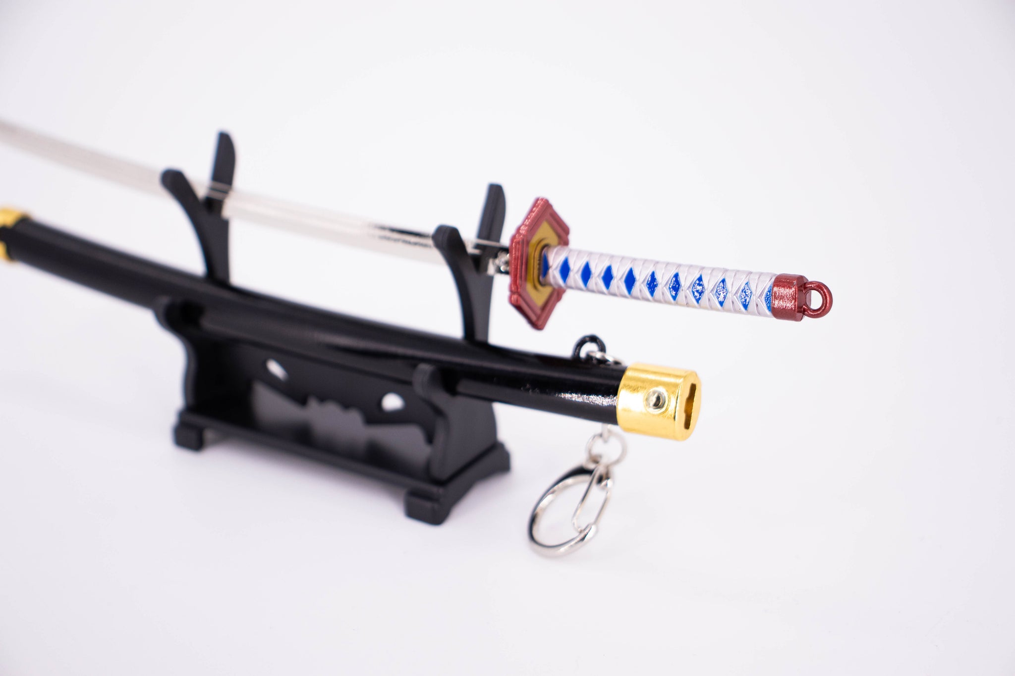 DEMON SLAYER – GIYU TOMIOKA’S NICHIRIN SWORD KEYCHAIN – FF COLLECTIBLES