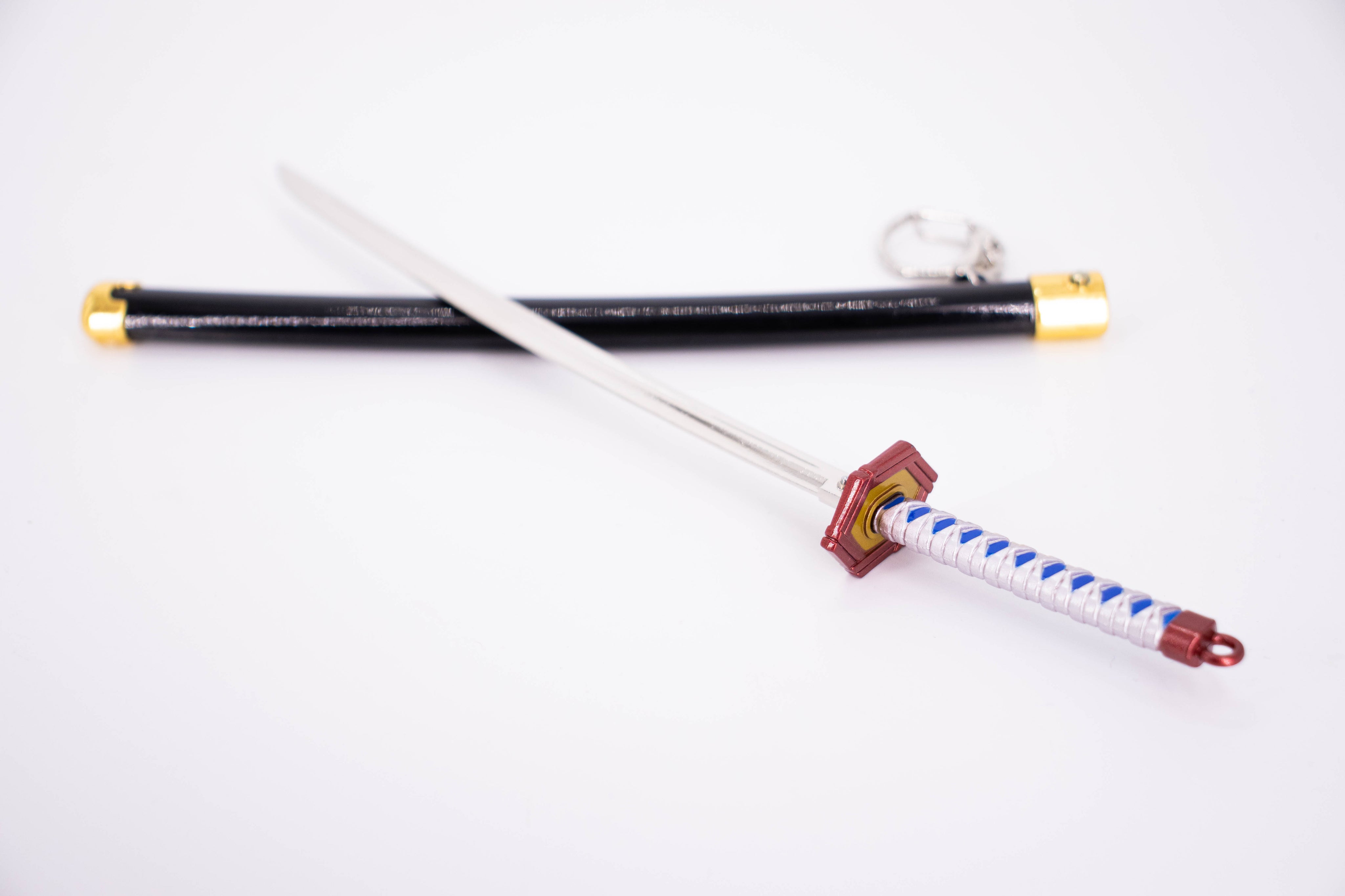 DEMON SLAYER – GIYU TOMIOKA’S NICHIRIN SWORD KEYCHAIN – FF COLLECTIBLES