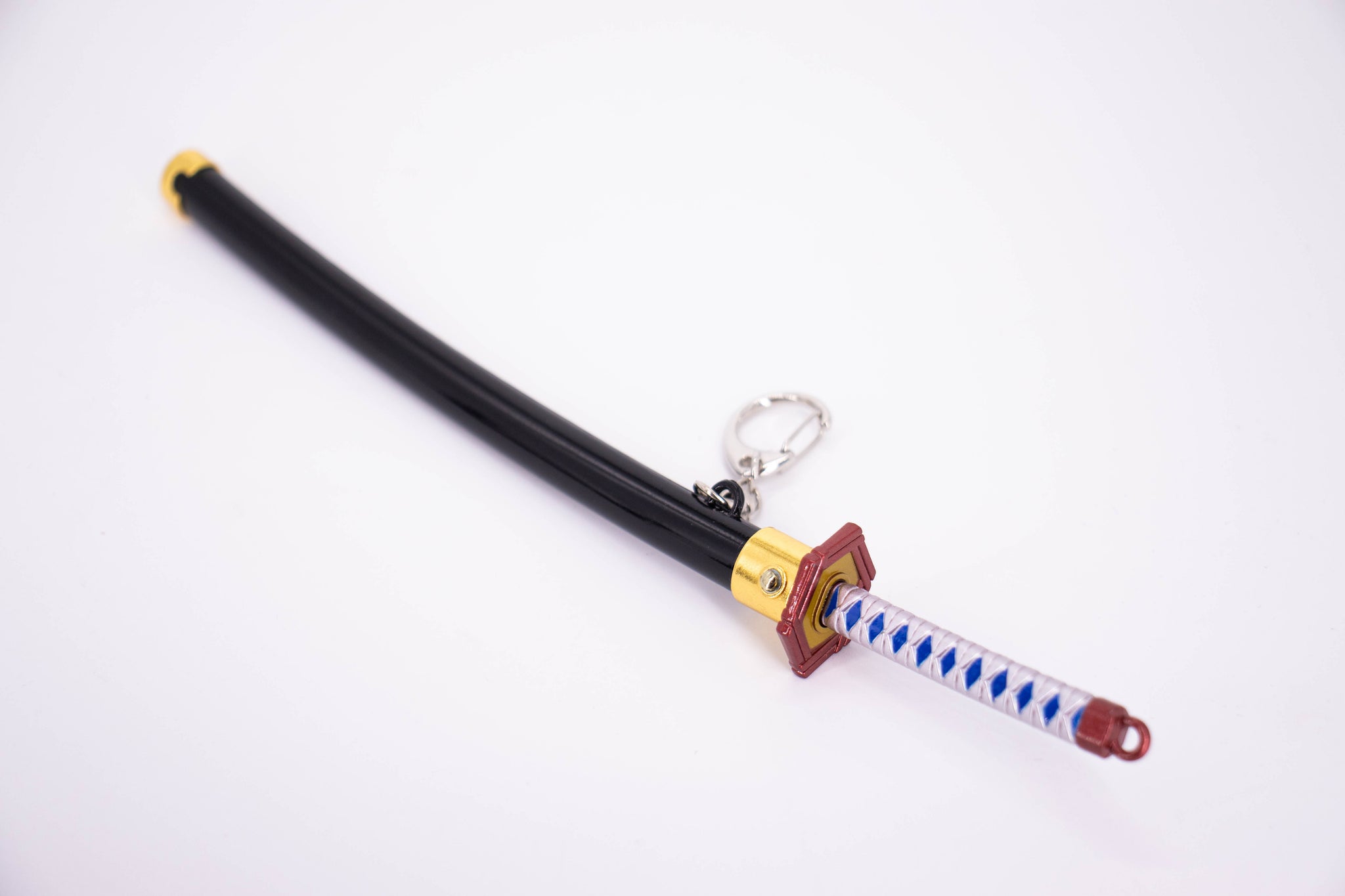 DEMON SLAYER – GIYU TOMIOKA’S NICHIRIN SWORD KEYCHAIN – FF COLLECTIBLES
