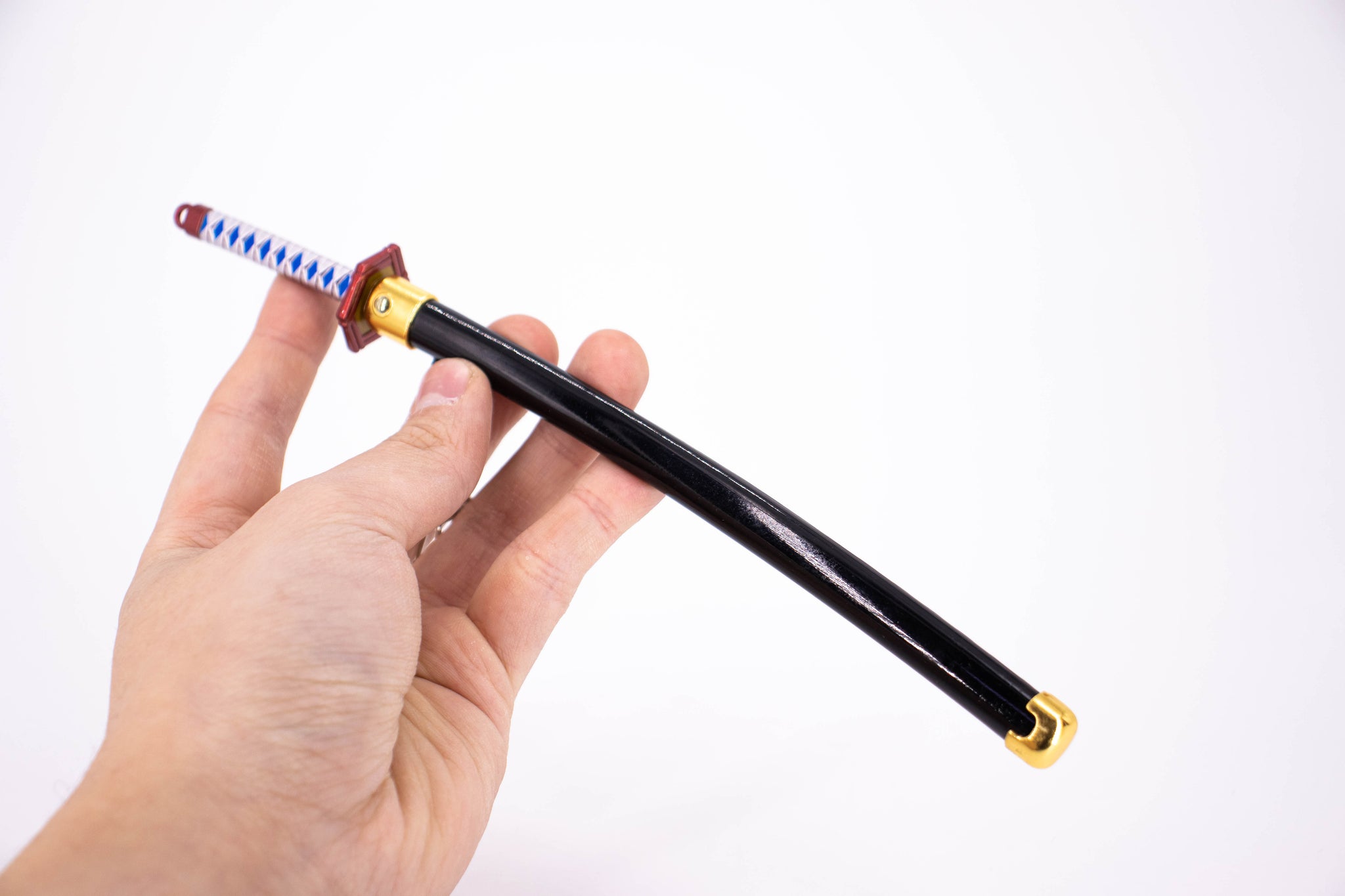 DEMON SLAYER – GIYU TOMIOKA’S NICHIRIN SWORD KEYCHAIN – FF COLLECTIBLES
