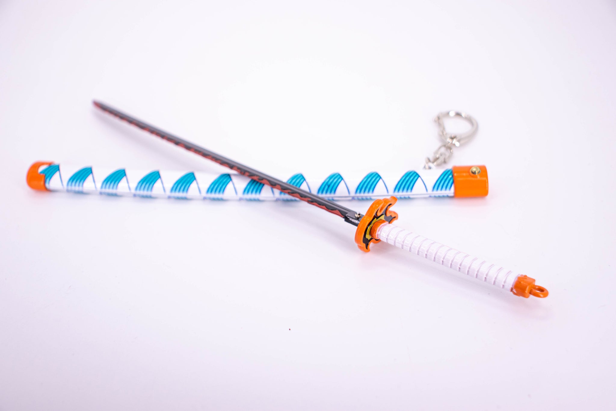 DEMON SLAYER – KYOJURO RENGOKU’S NICHIRIN SWORD KEYCHAIN – FF COLLECTIBLES